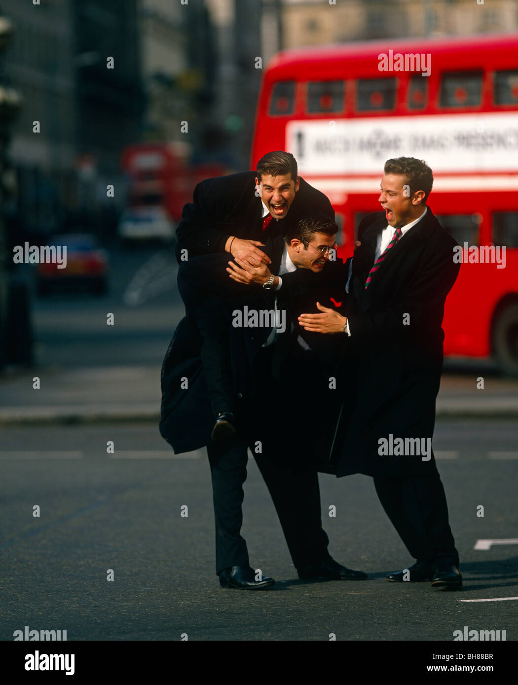 Men celebrating in suits hi-res stock photography and images - Alamy