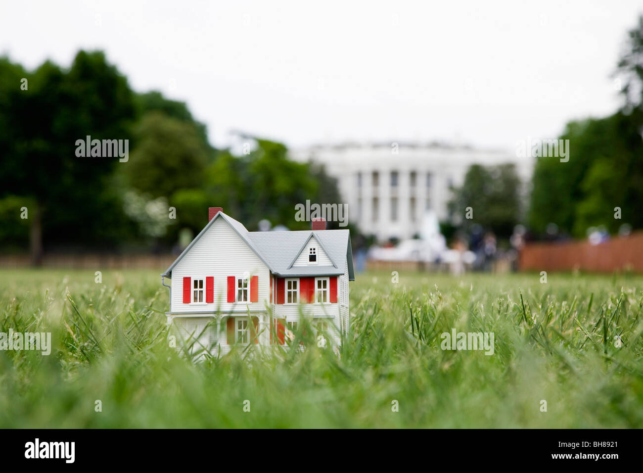 A model of a domestic house in front of the White House, Washington DC ...