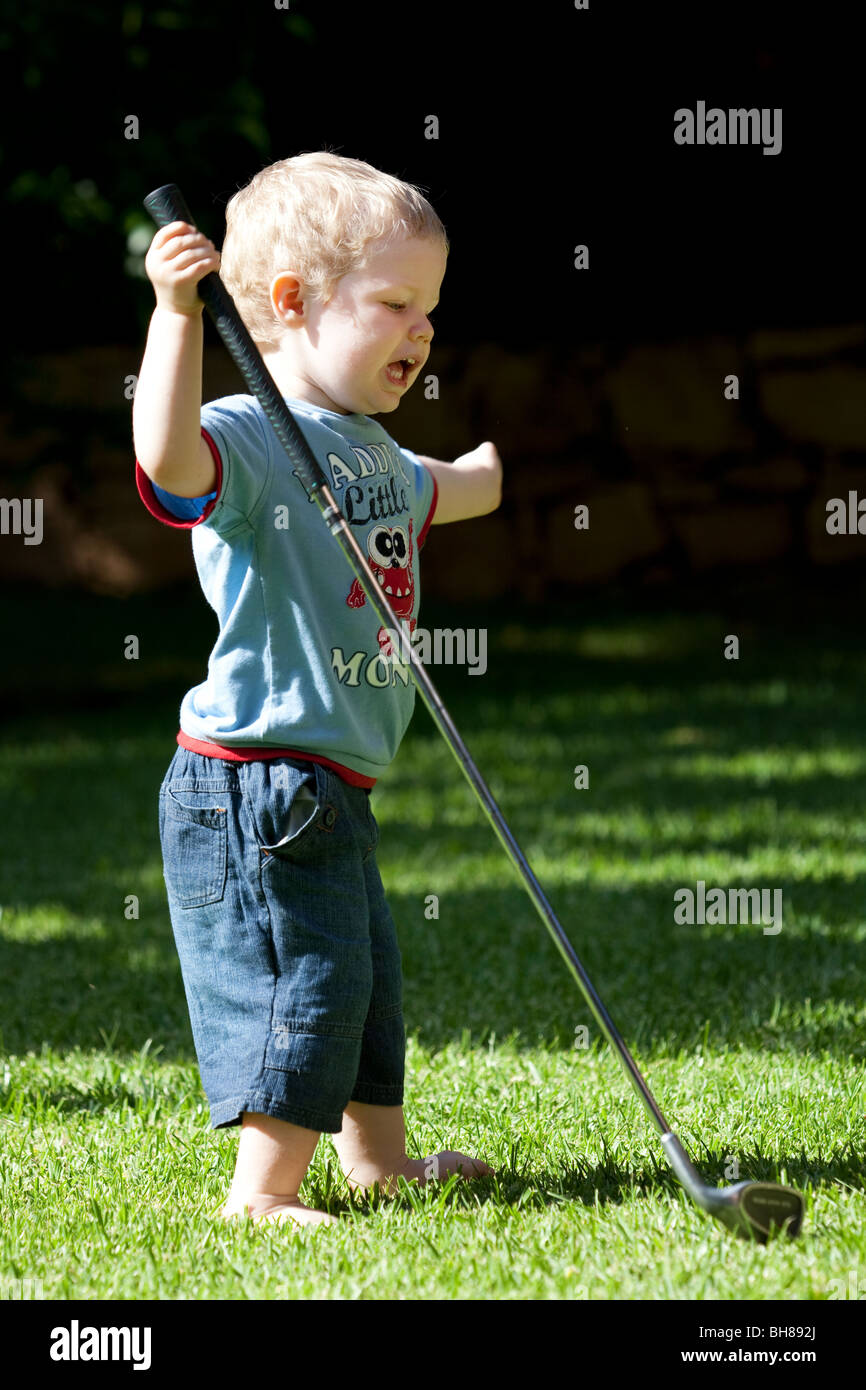 Happy boy playing golf hi-res stock photography and images - Alamy