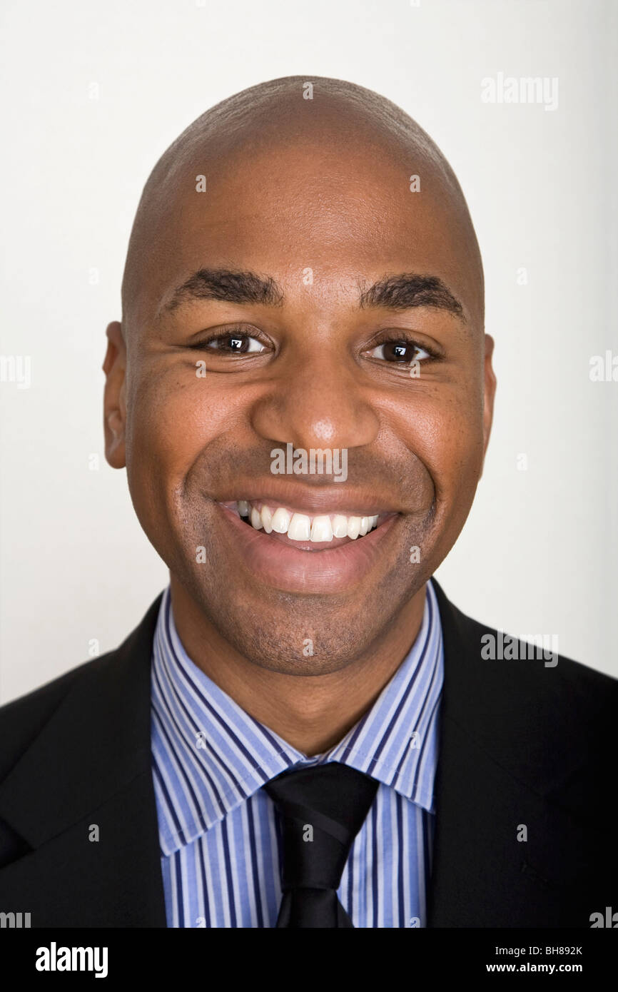 Portrait of a well dressed man smiling Stock Photo - Alamy
