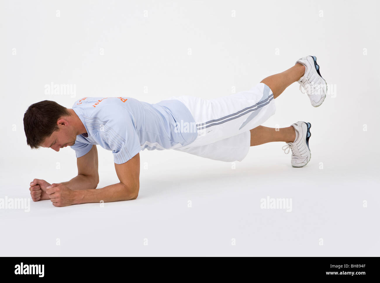 Leg raises exercise white background hi-res stock photography and ...