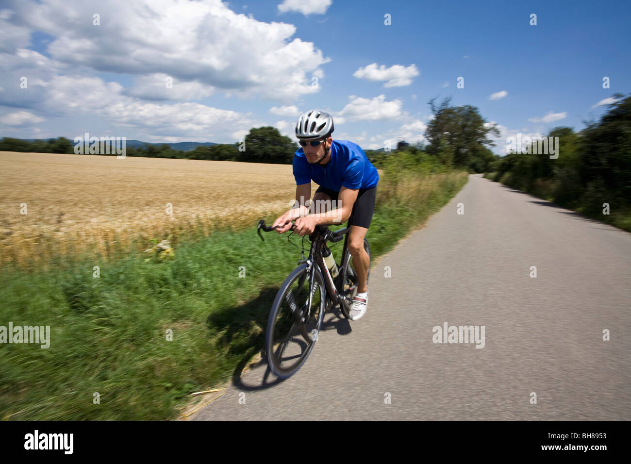 A man riding a bicycle Stock Photo - Alamy