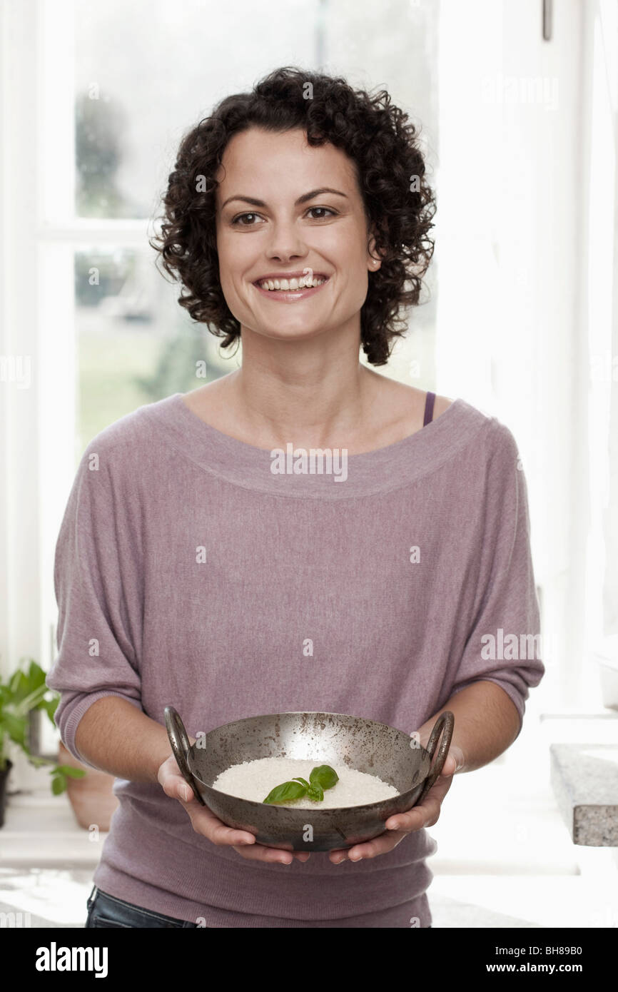 Woman holding brown rice hi-res stock photography and images - Alamy