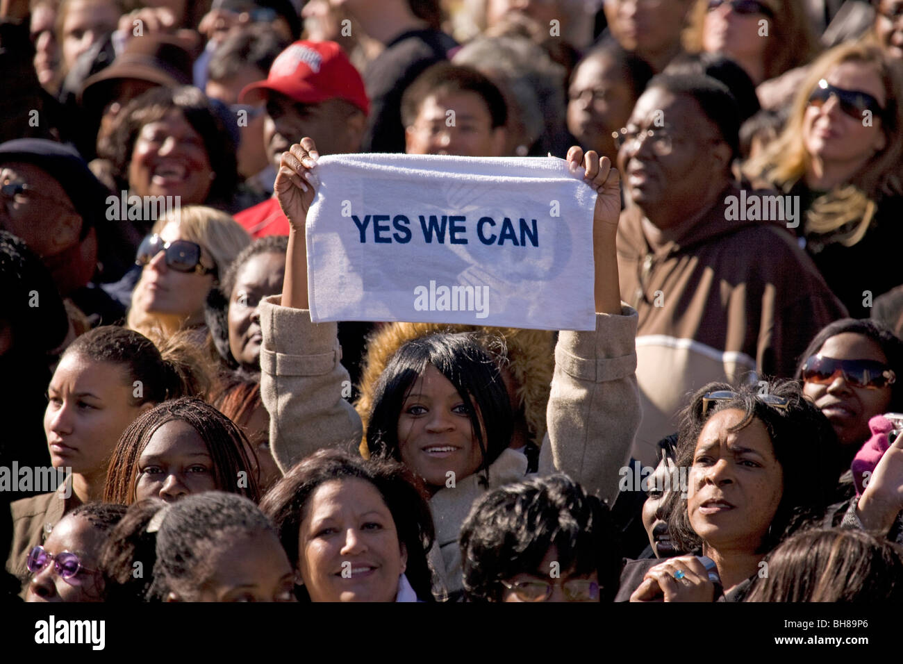 African American holding Yes We Can sign at early vote for change ...