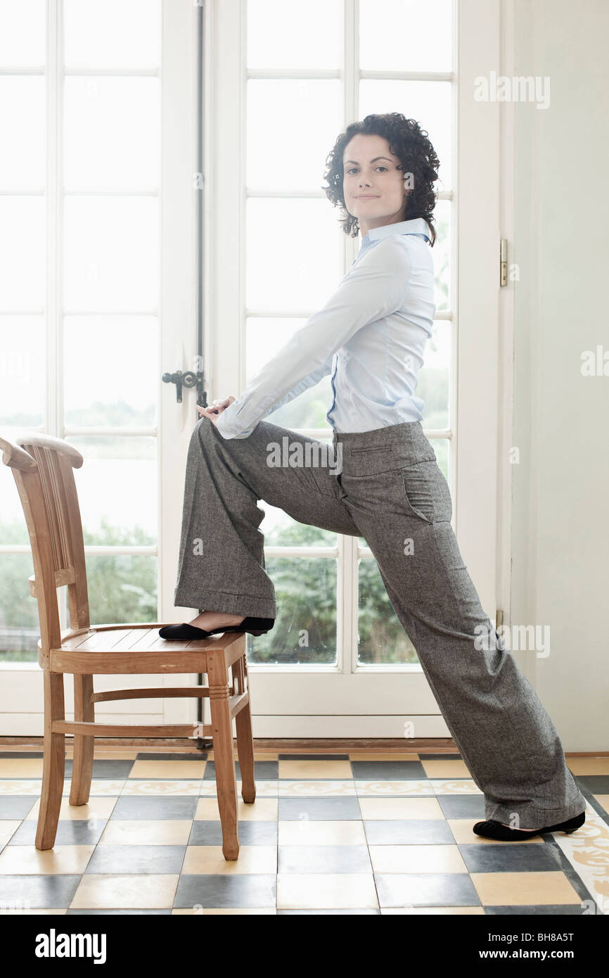 Leaning against a chair hi-res stock photography and images - Alamy