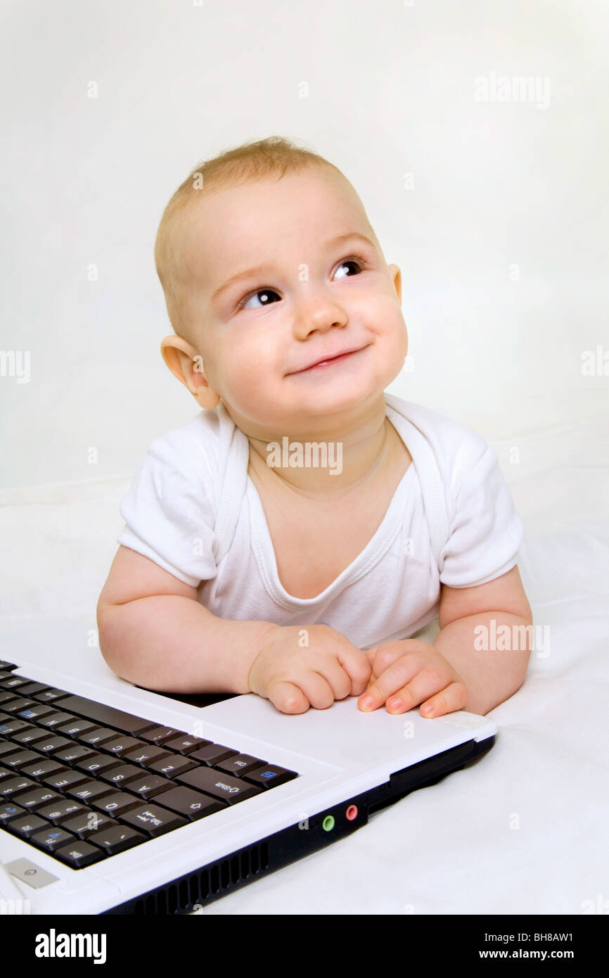 portrait of adorable baby with laptop Stock Photo - Alamy