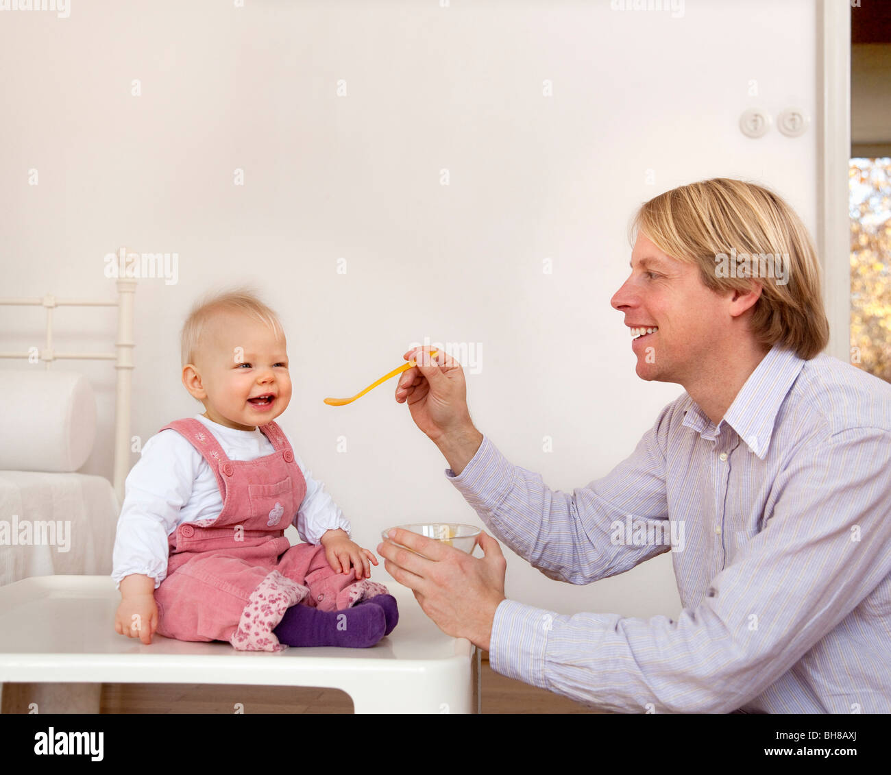 father feeding baby Stock Photo - Alamy