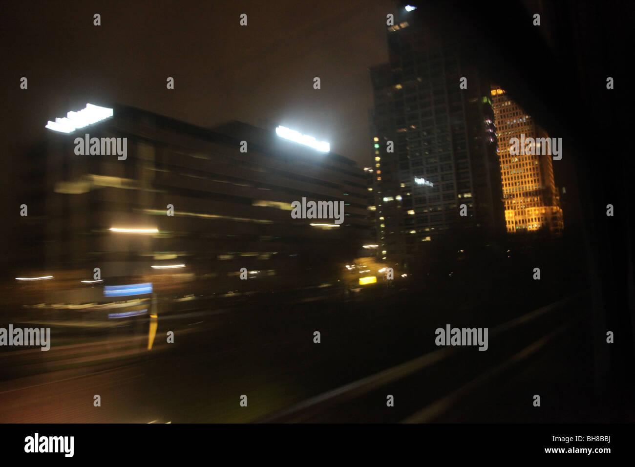 View of Amsterdam at night time from the train window I Stock Photo - Alamy