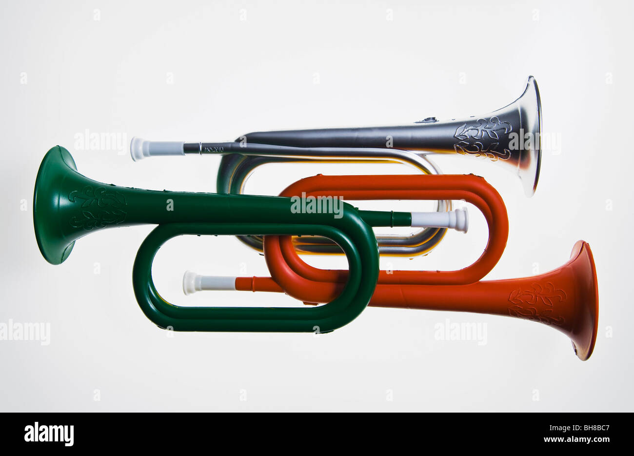 Three miniature toy horns Stock Photo - Alamy