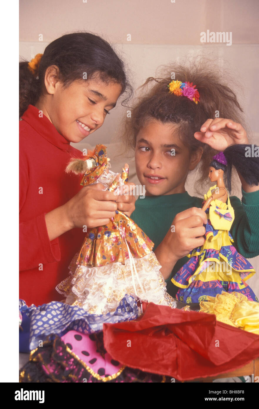 two girls playing with Barbie dolls Stock Photo - Alamy