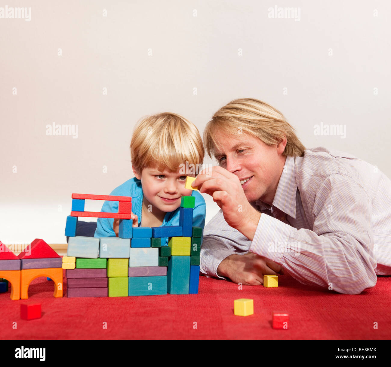 father and son play with building blocks Stock Photo - Alamy