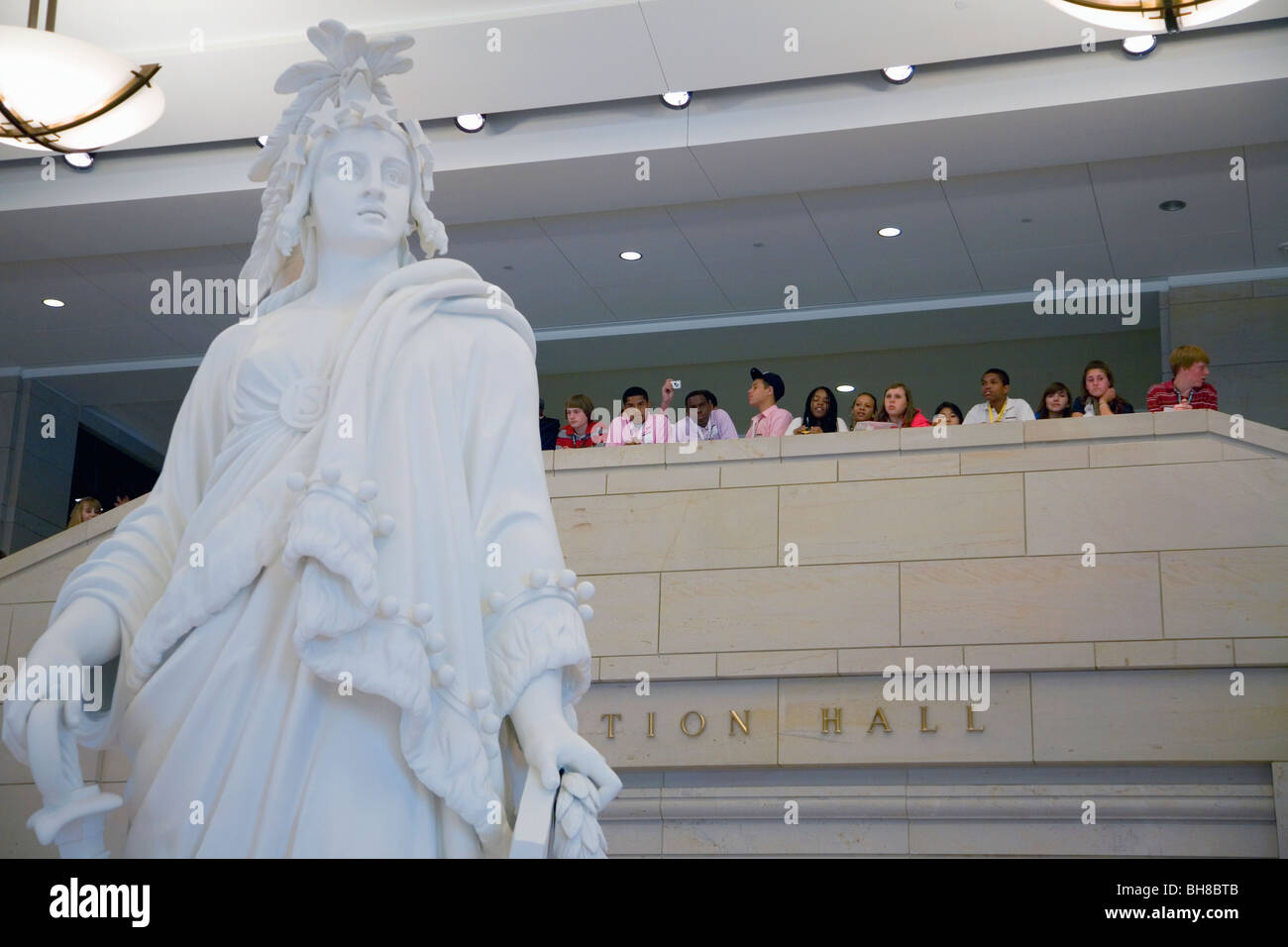 Students visiting U.S. Capitol look down on statue mold of Statue of ...