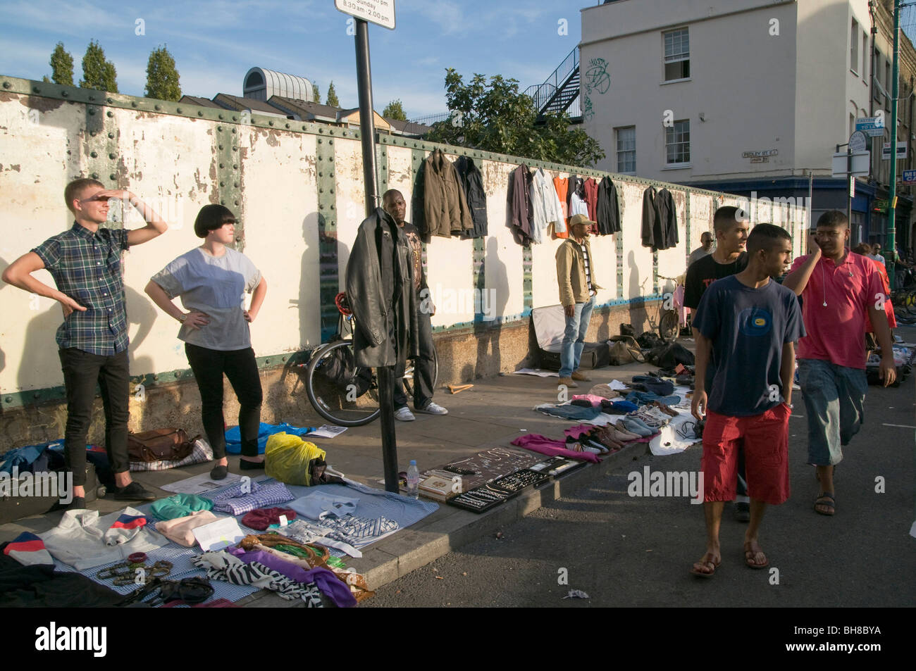 UK.People selling and bartering clothes and goods at Sunday market in ...