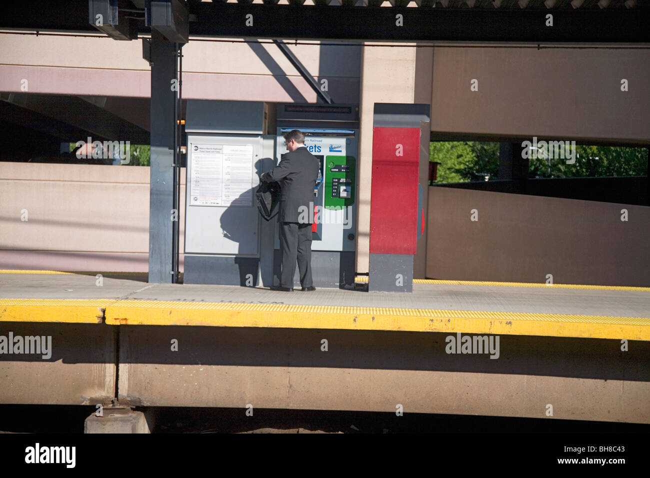 Business man in front of vending machine at station hi-res stock ...