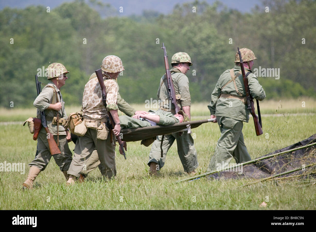 World War II reenactment of a battle between American infantryman and ...