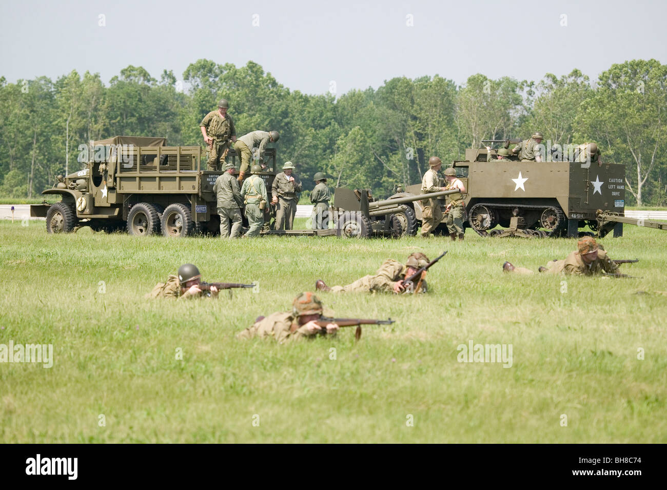 World War II reenactment of a battle between American infantryman and ...