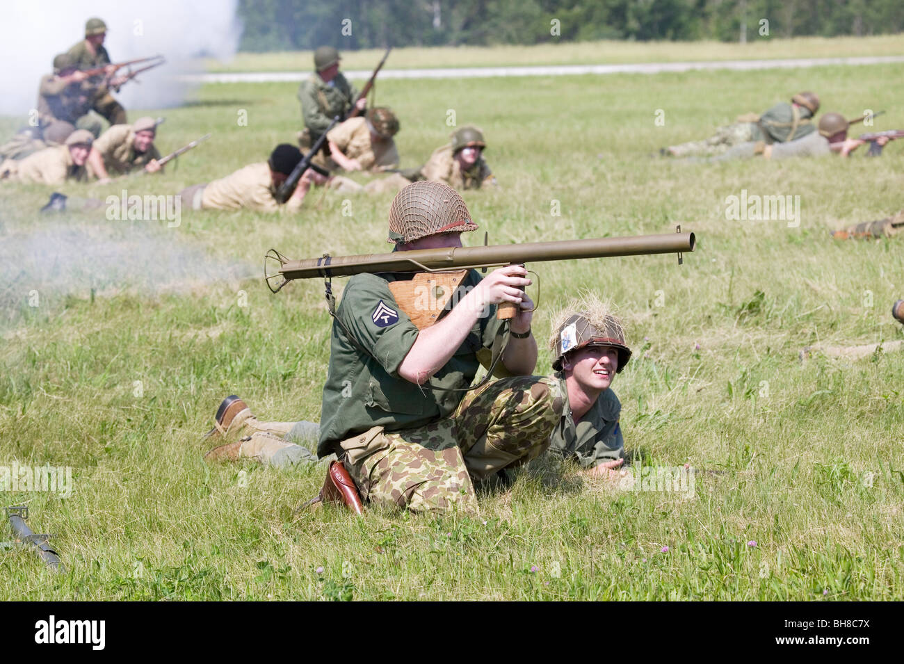 World War II reenactment of a battle between American infantryman and ...