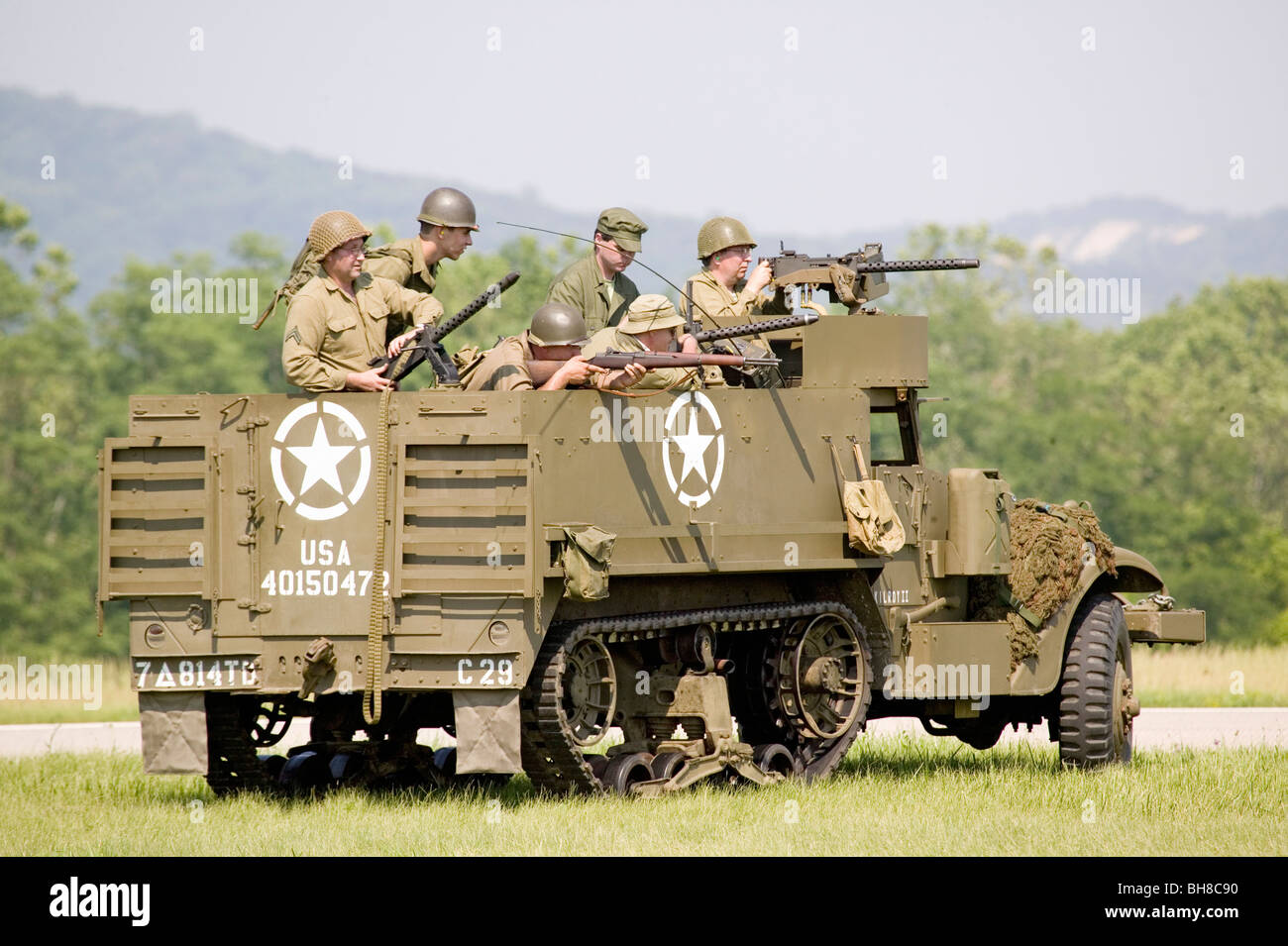 World War II reenactment of a battle between American infantryman and ...