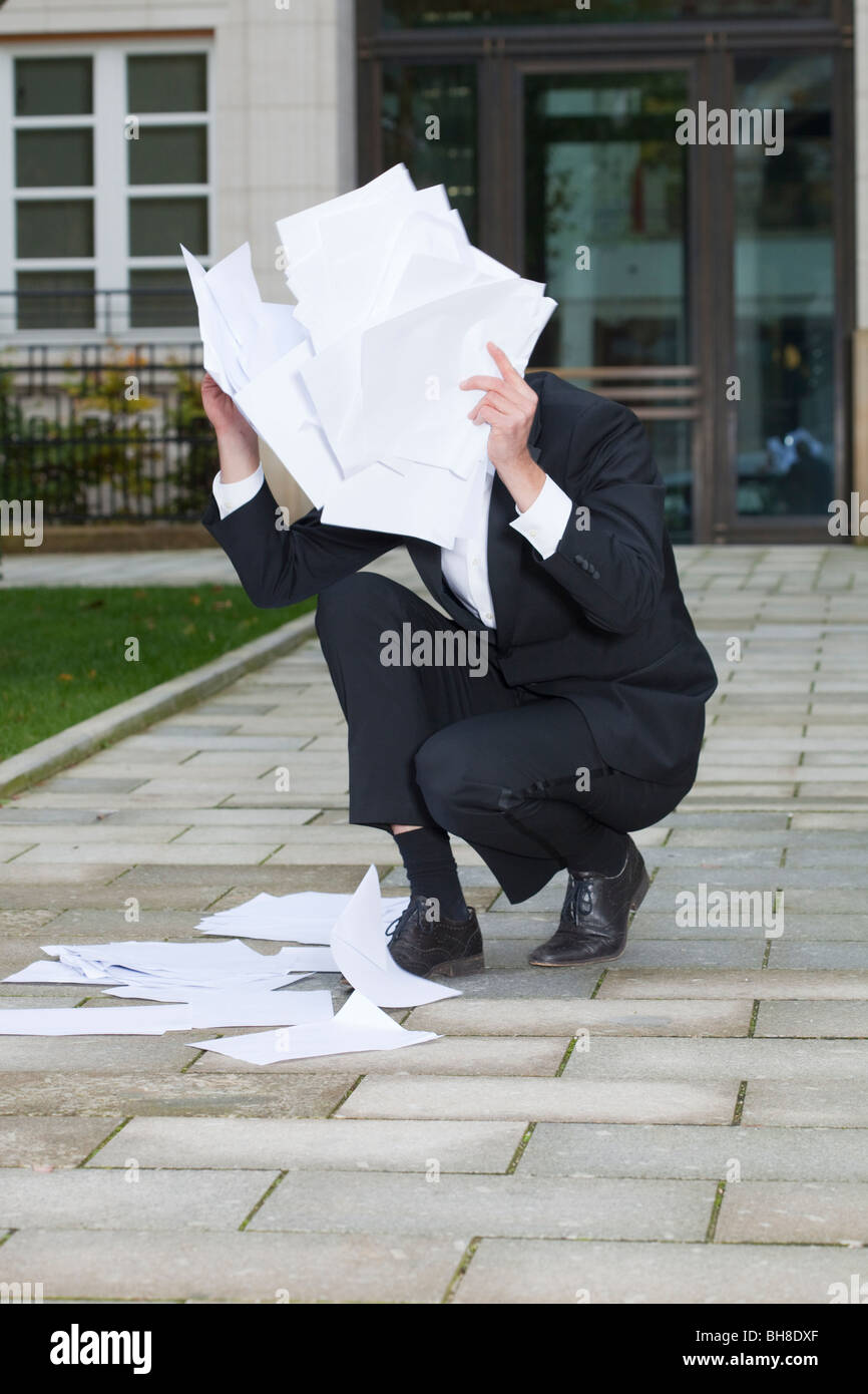 businessman hiding face behind paper Stock Photo - Alamy