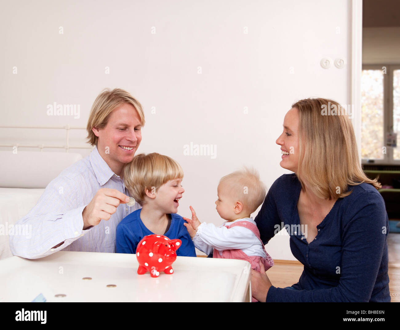 family saving money Stock Photo - Alamy