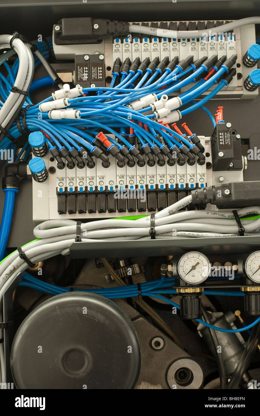 Tubes, valves and wires in an offset printing press Stock Photo - Alamy