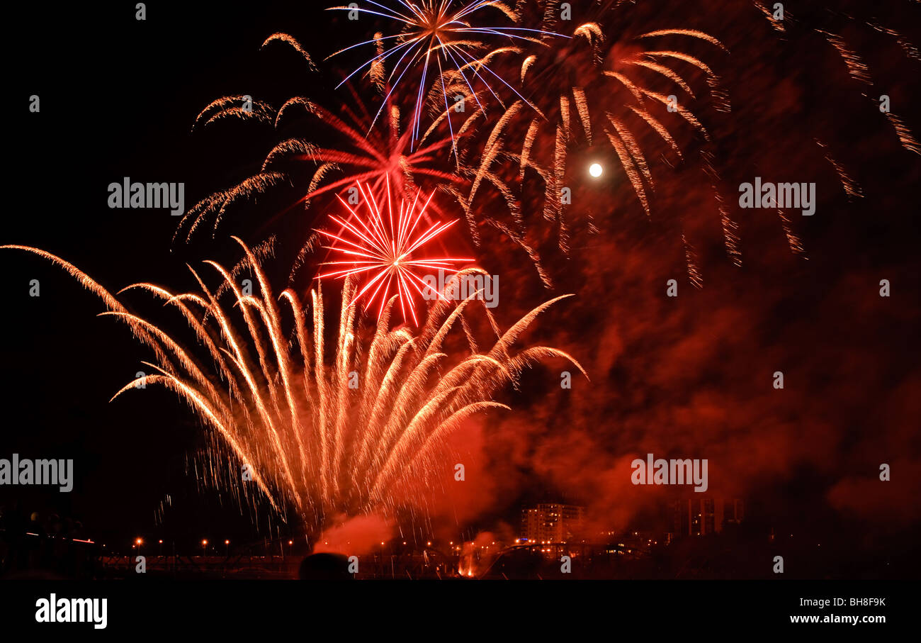 A colorful fireworks display going off in the night Stock Photo - Alamy