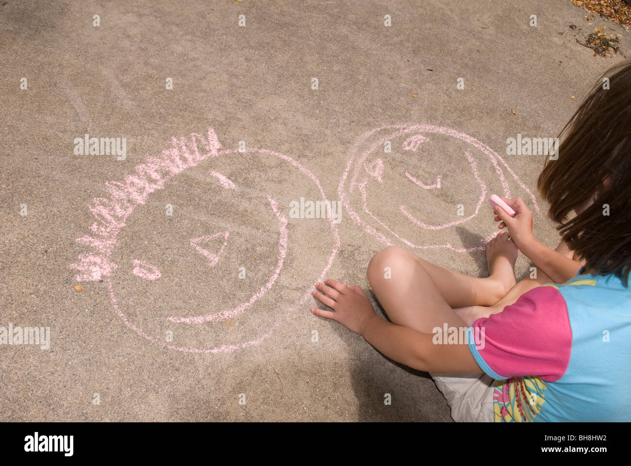 Child drawing with chalk Stock Photo - Alamy