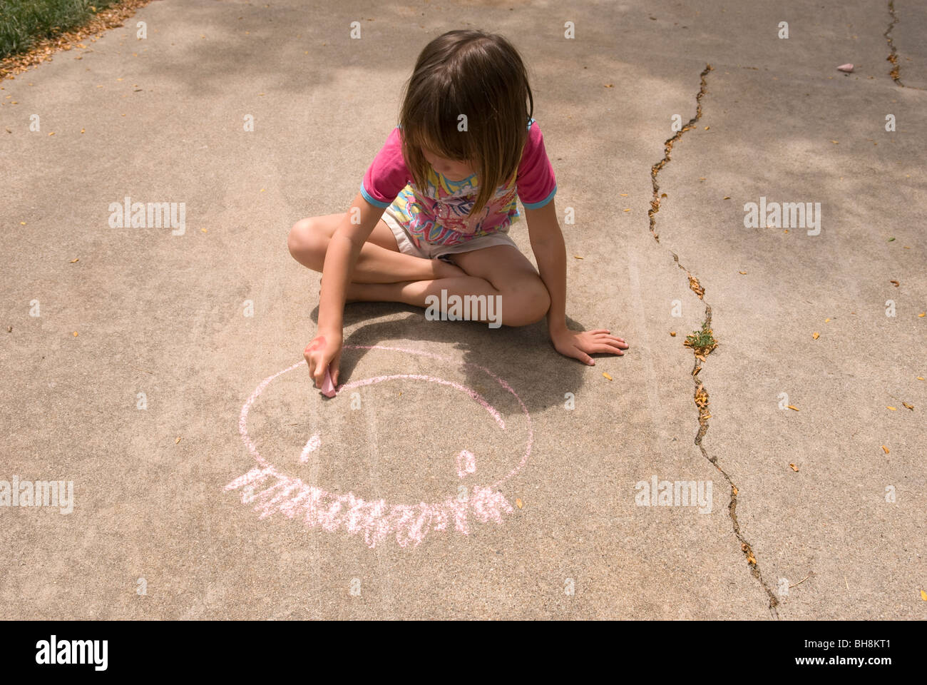 Child drawing with chalk Stock Photo - Alamy