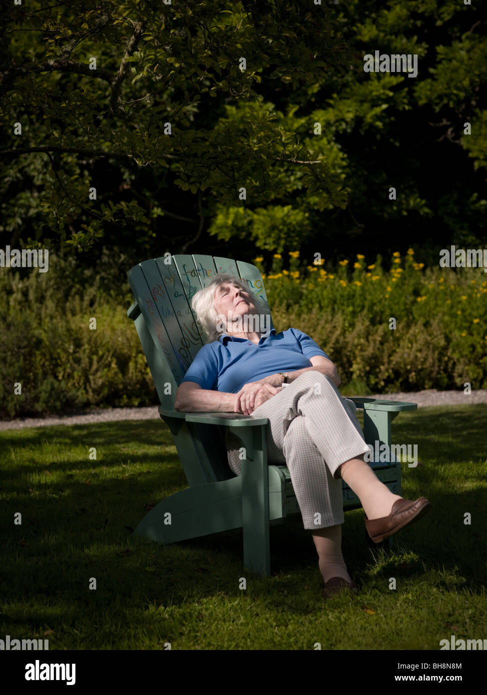 old lady in wooden chair sleeping Stock Photo - Alamy