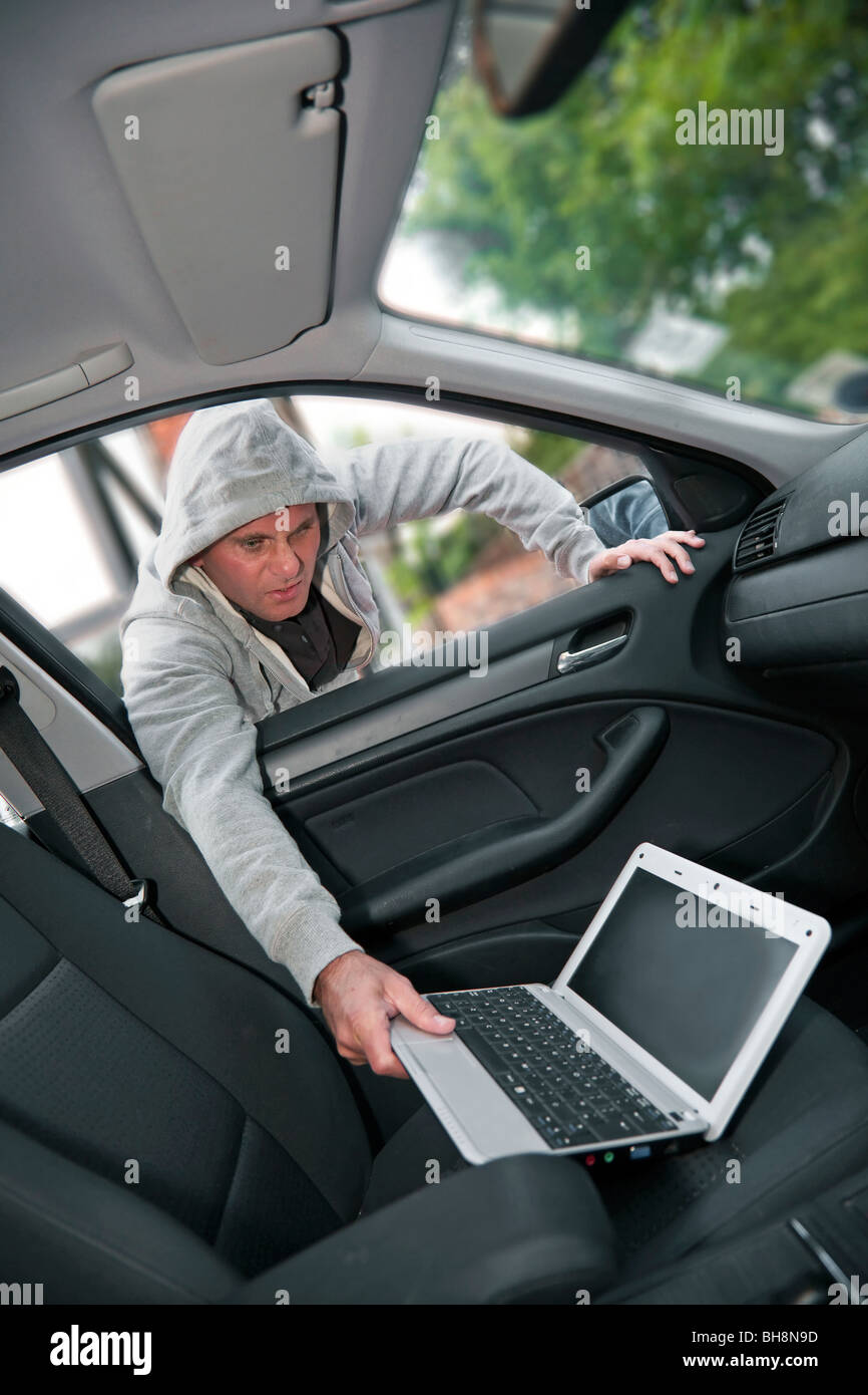 Car theft - a laptop being stolen through the window of an unoccupied ...