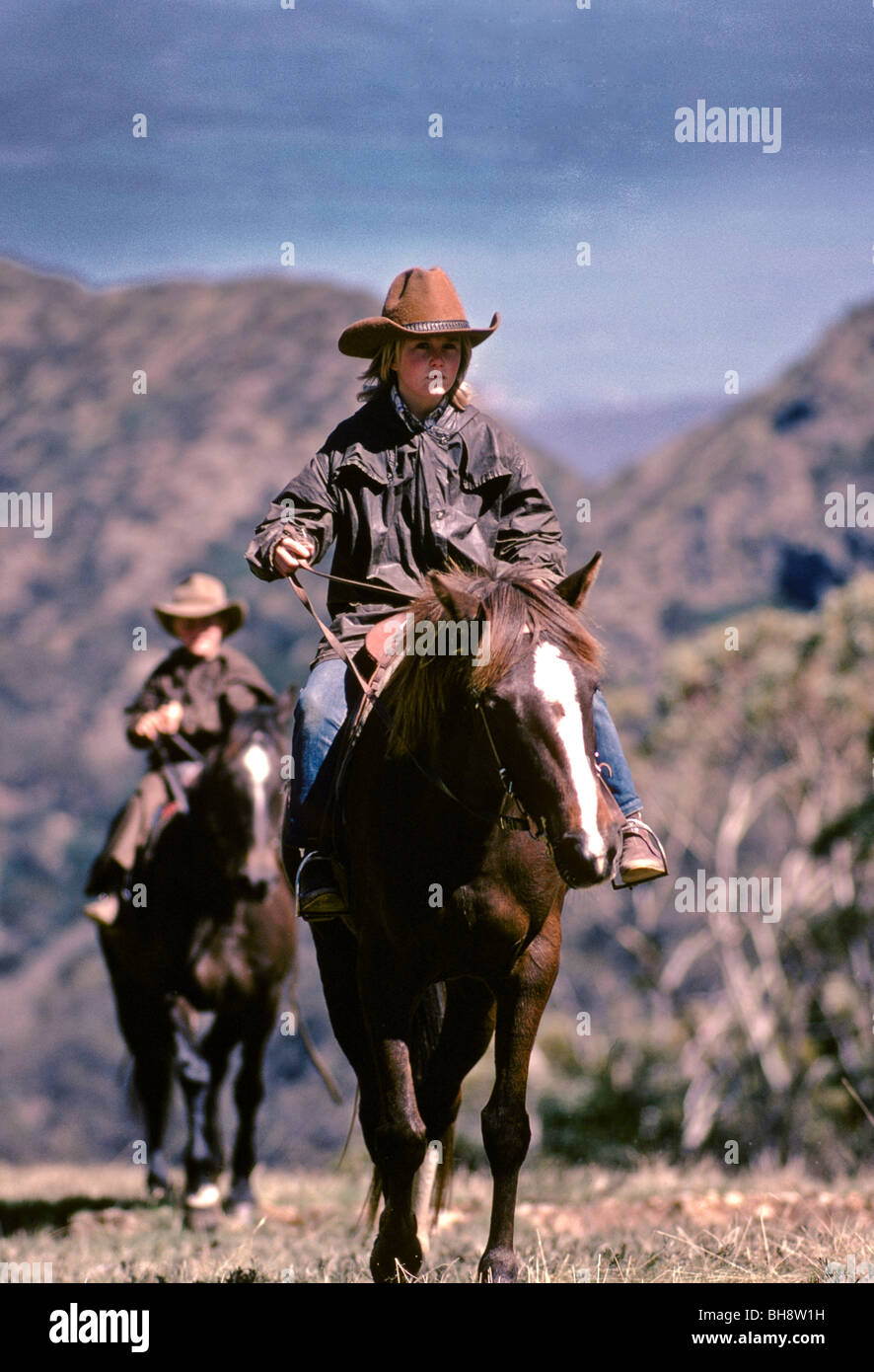 Two boys riding horses hi-res stock photography and images - Alamy