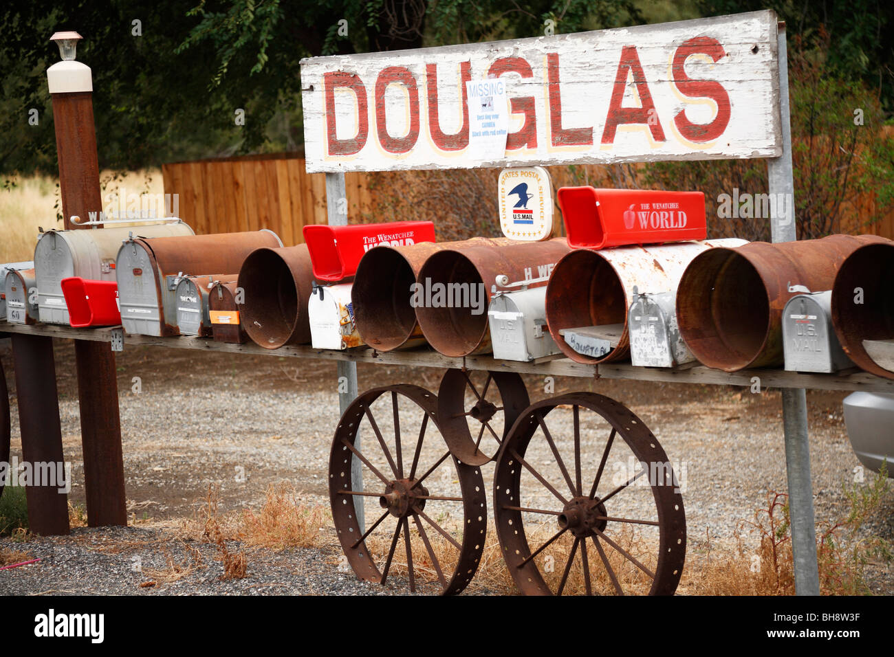 Row of colourful old mail boxes and town sign, Douglas, Washington, USA ...