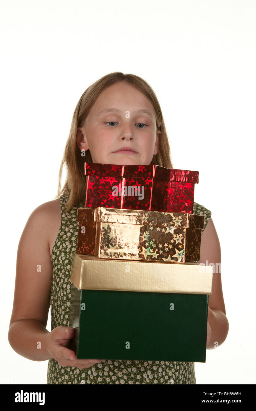 girl struggling to carry lots of presents Stock Photo - Alamy