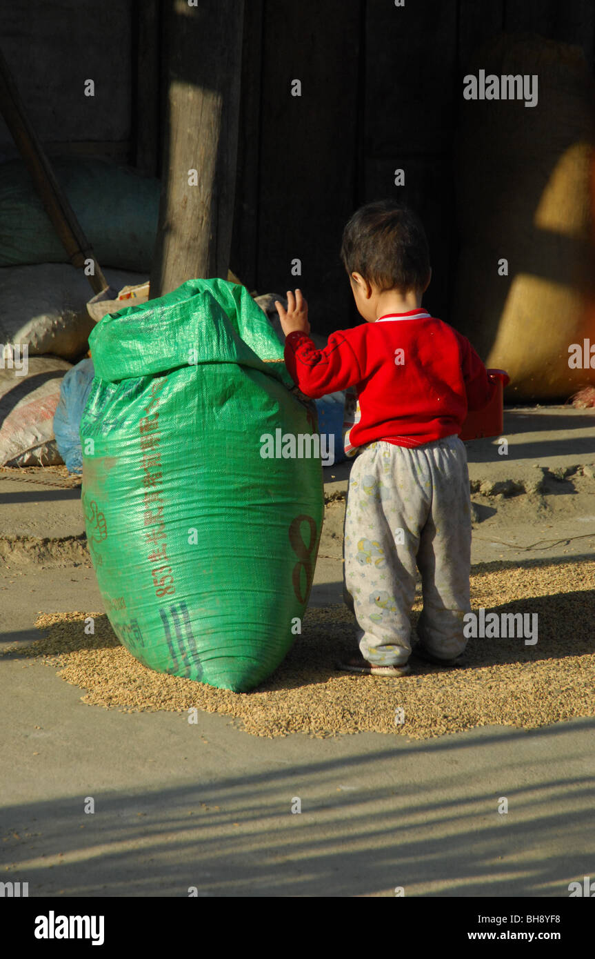 black hmong child playing , ta phin , near sapa , north west vietnam ...