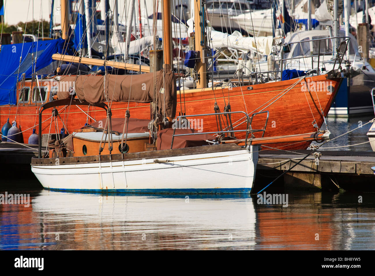 Traditional wooden yachts moored at the Elephant Boatyard, Bursledon ...