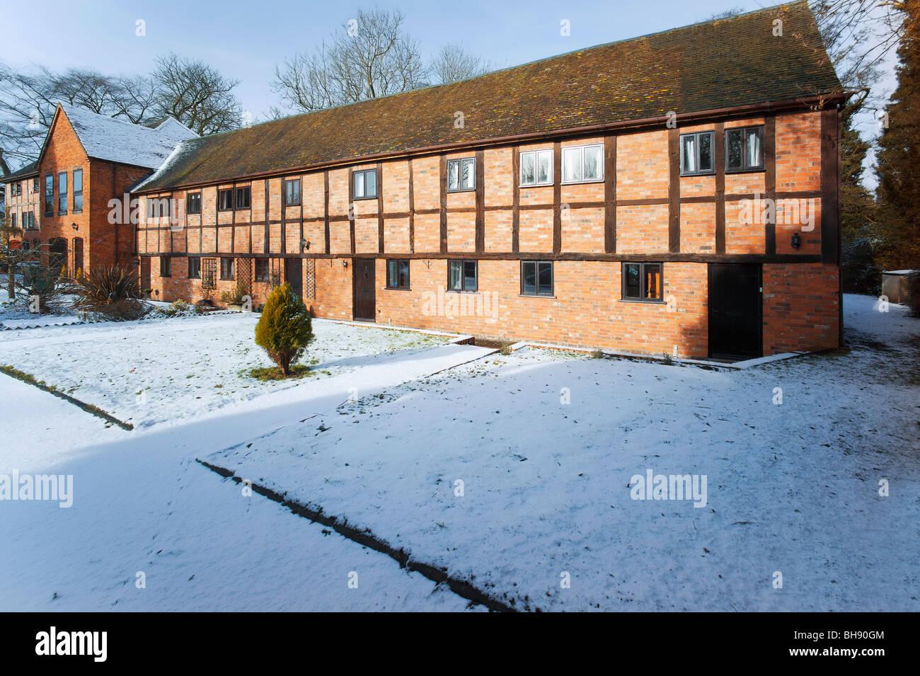 a row of old houses converted from an old mill building Stock Photo - Alamy