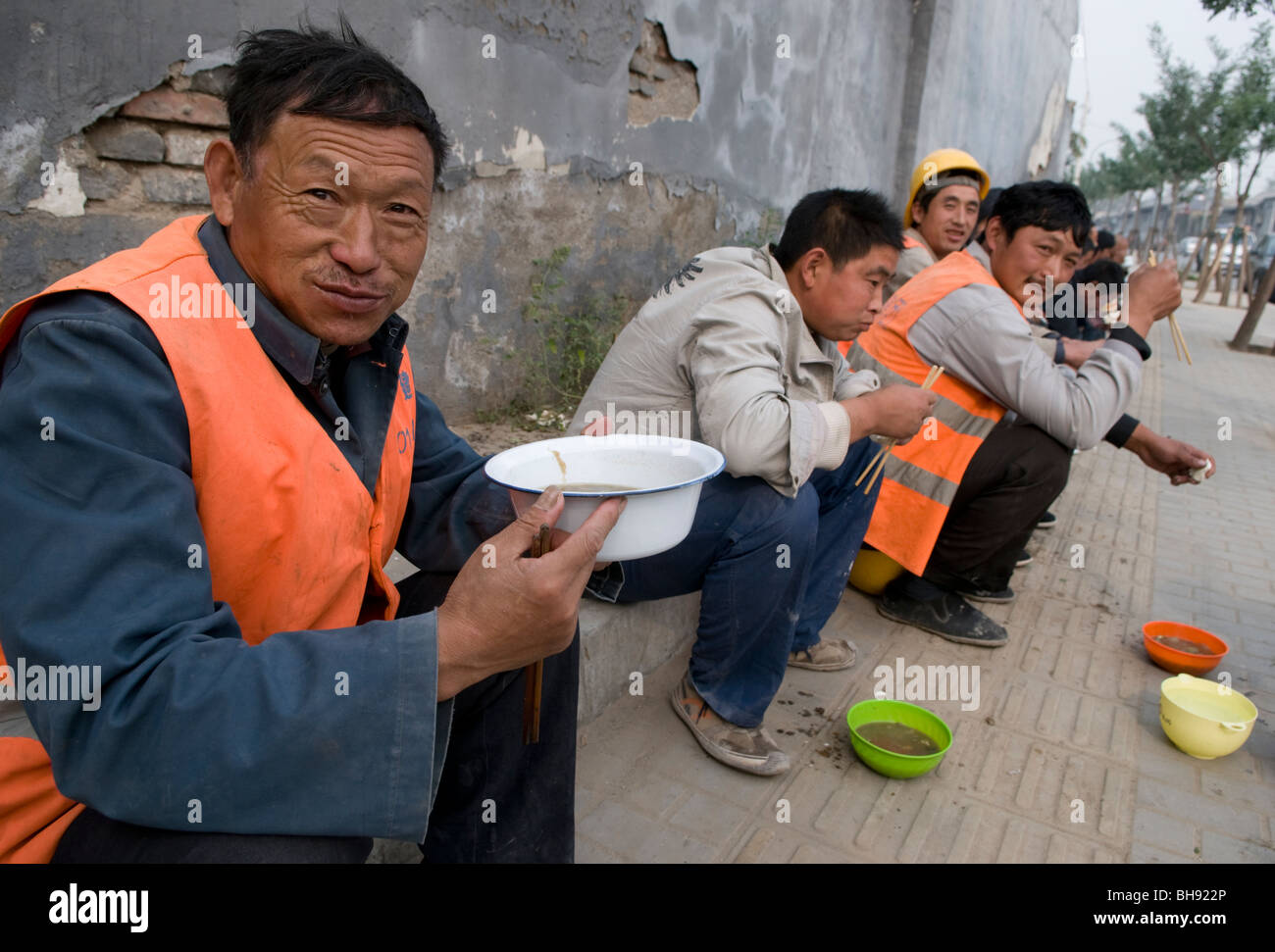Construction workers pausing for a lunch break in Beijing China Stock ...