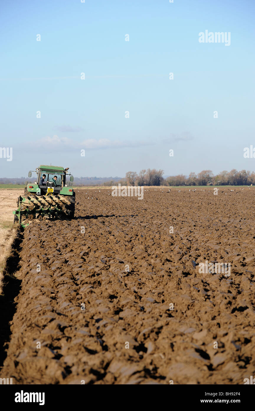 Tractor ploughing field ploughed plow hi-res stock photography and ...