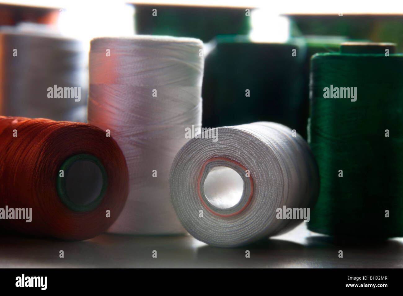 Different coloured spools Stock Photo - Alamy
