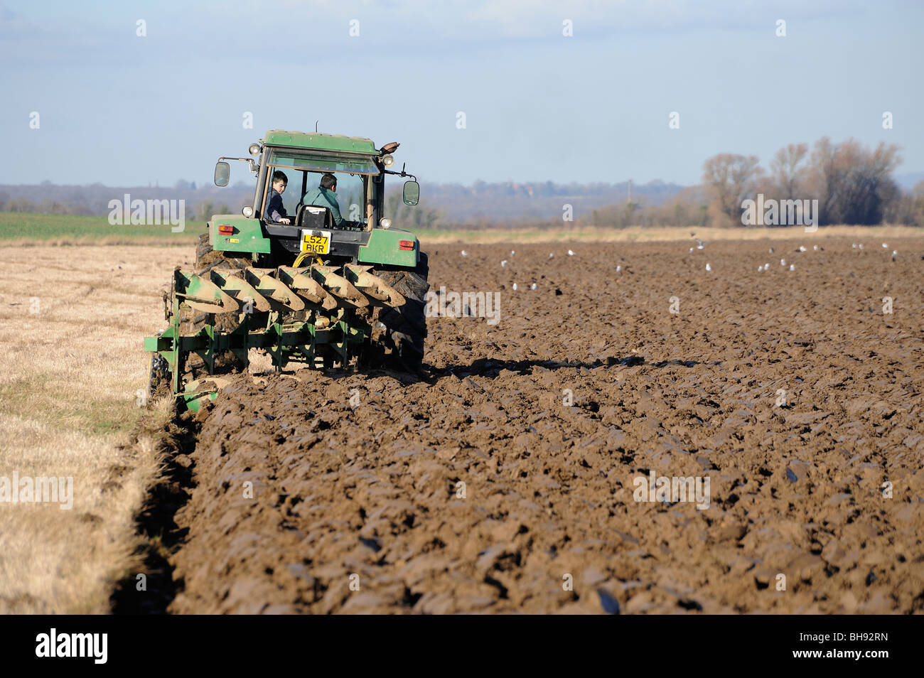 Tractor ploughing field ploughed plow hi-res stock photography and ...