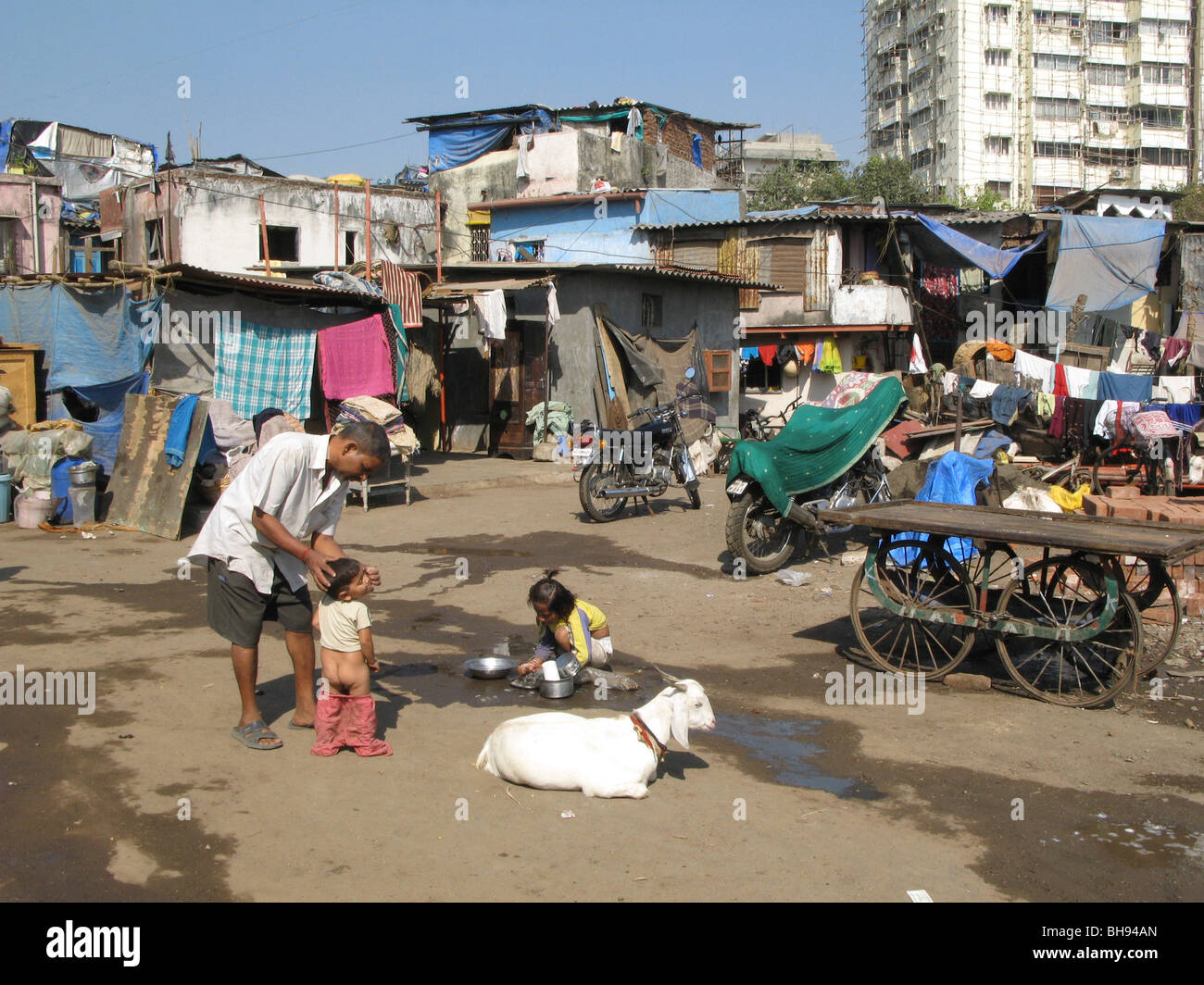 INDIA Slums by the harbour in Colaba with new high rise buildings in ...