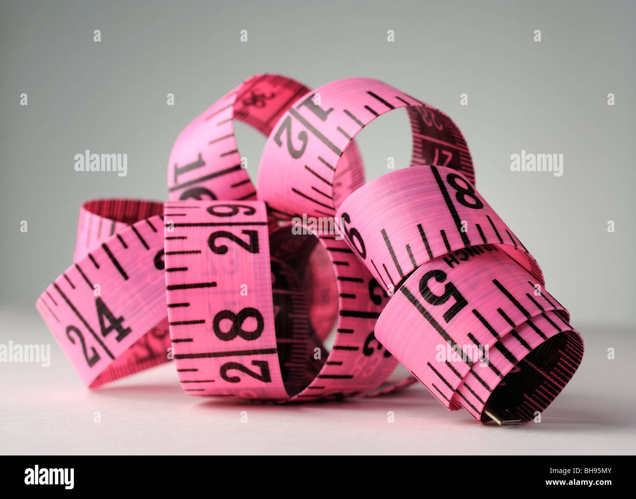 pink dress makers tape measure Stock Photo - Alamy