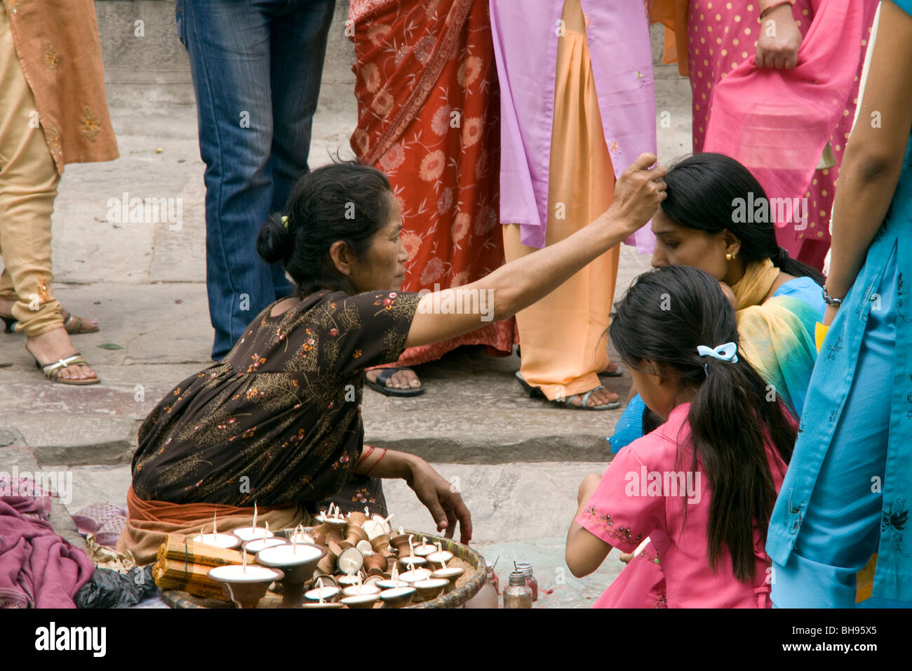 buddhist devotee receiving blessing at the swayambunath stupa Stock ...