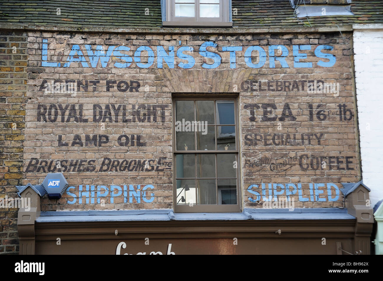 old hand painted sign on a building side Stock Photo - Alamy