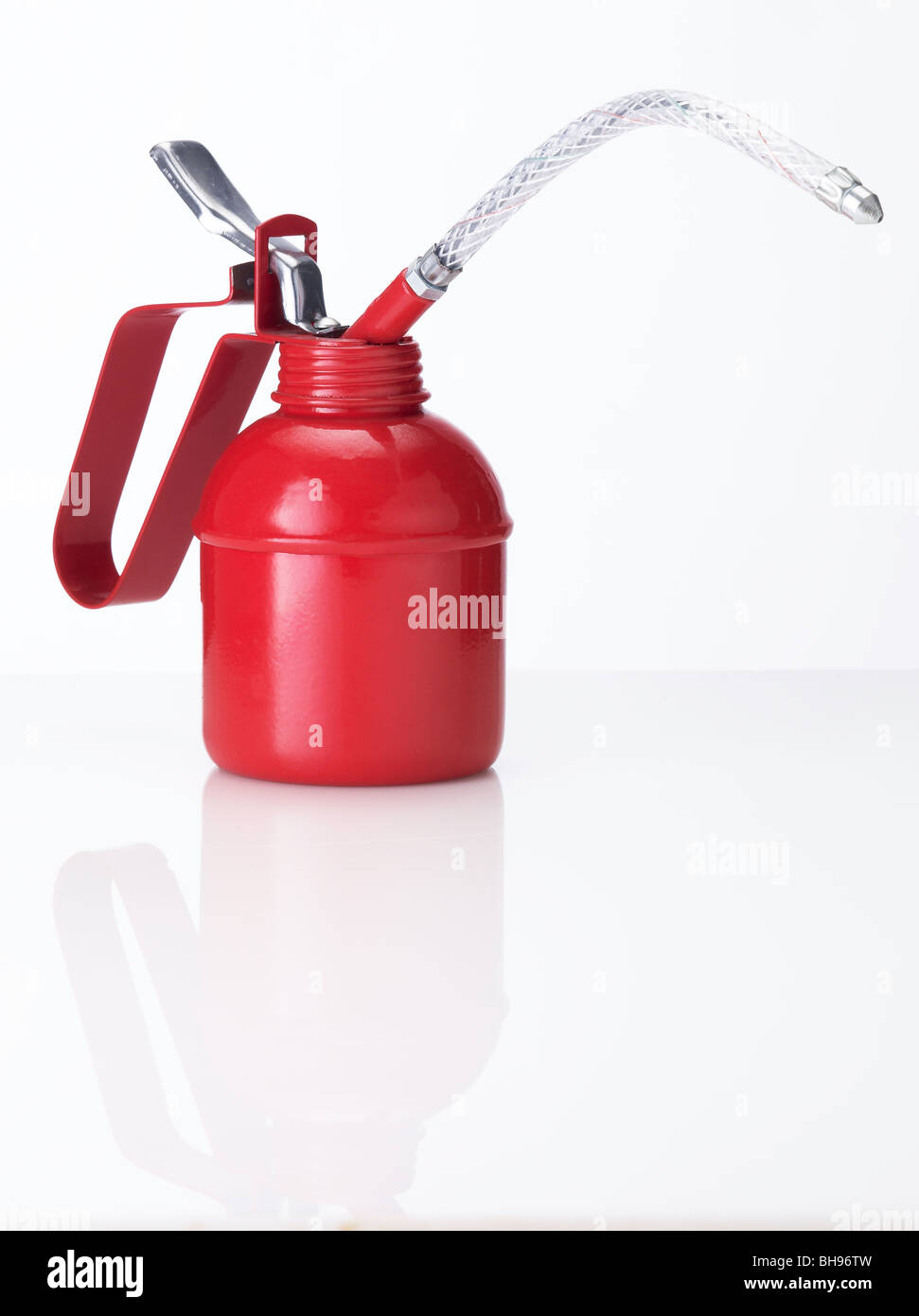 Traditional red oil can on a white background Stock Photo - Alamy