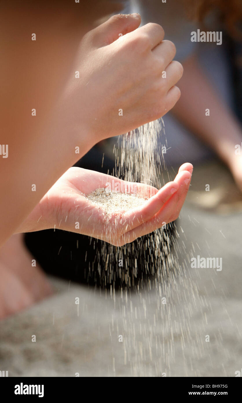 Child playing with sand Stock Photo - Alamy