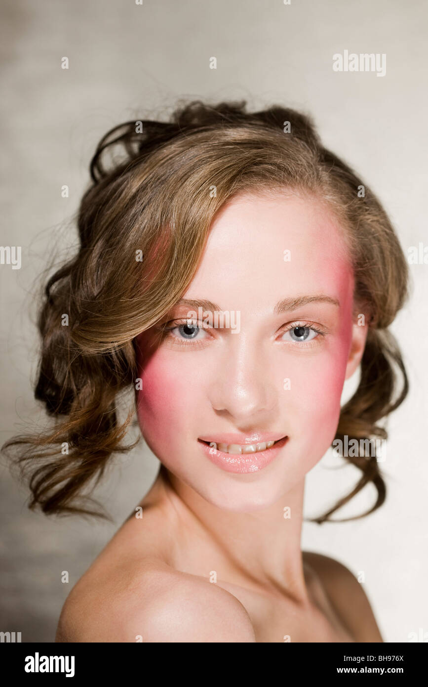 Young woman with rouge on her cheeks Stock Photo - Alamy