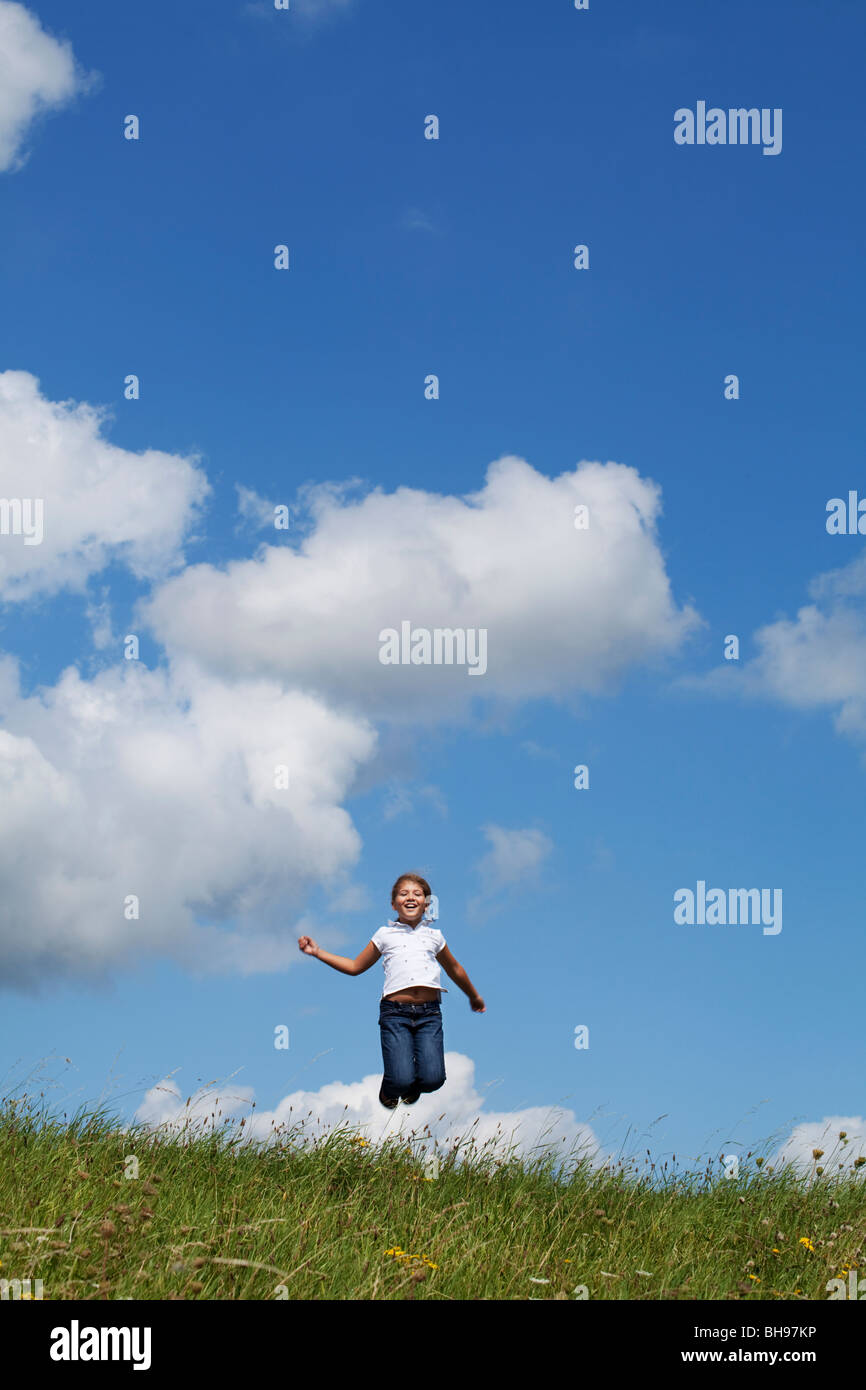 Kid jumping high in the sky Stock Photo - Alamy
