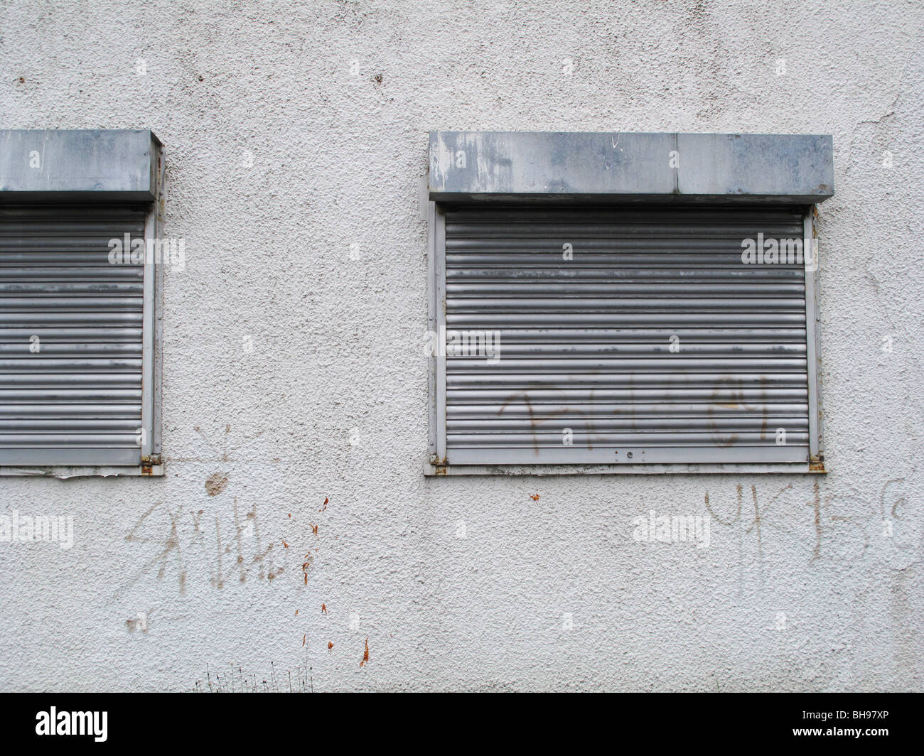 Shuttered windows on empty factory Stock Photo - Alamy
