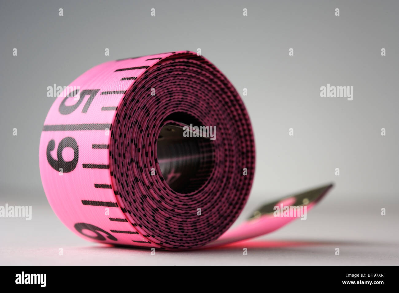 pink dress makers tape measure Stock Photo - Alamy